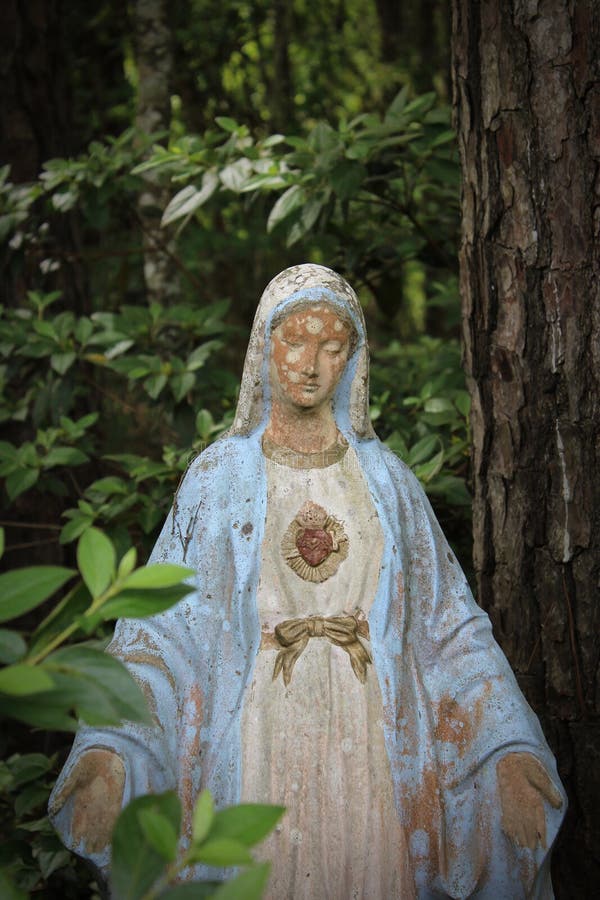 A Small Statue of Mary among the Trees Stock Image - Image of sacred ...
