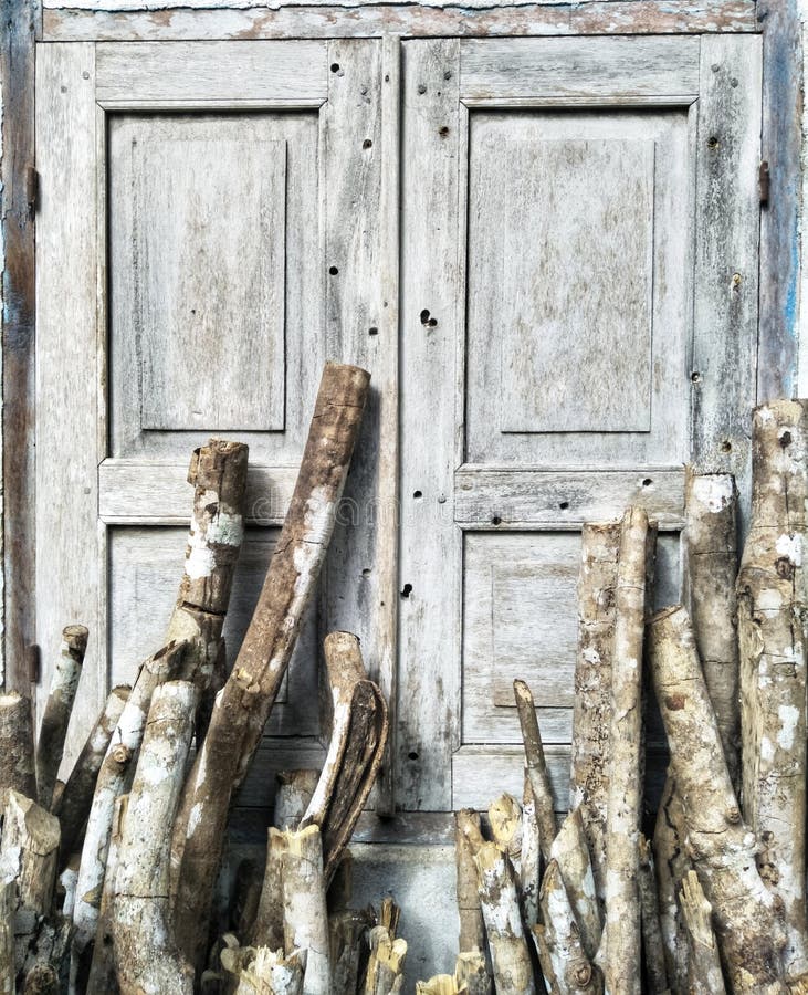 A Small Old Window Was Behind a Pile of Wood Stock Image - Image of ...