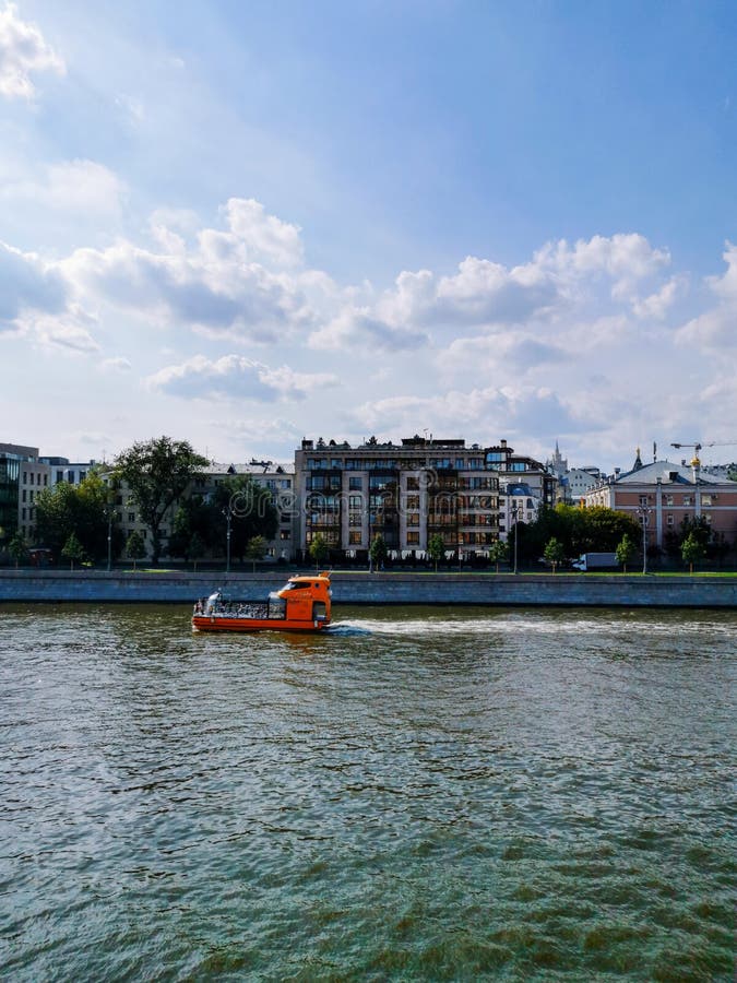Orange Boat Sailing at High Speed in Antarctic Waters Against Mo ...