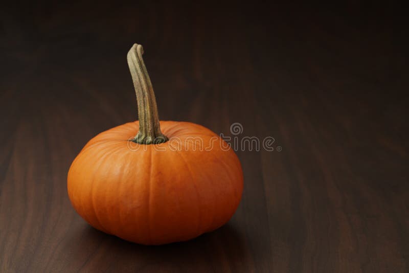 Small Orange Pumpkin for Halloween on Wood Table Stock Photo - Image of ...