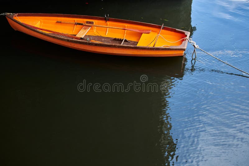 Small Orange Row Boat Moored on a River with No People Stock Photo ...