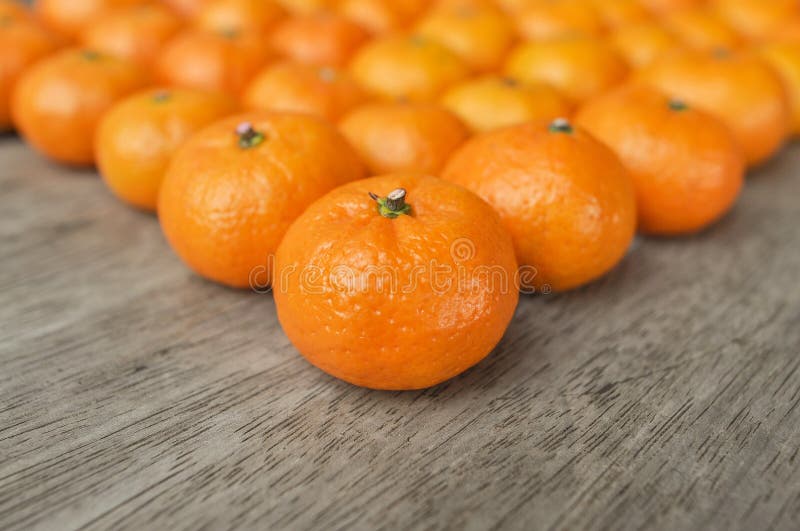 Small Oranges on Wooden Table Stock Photo - Image of round, healty ...