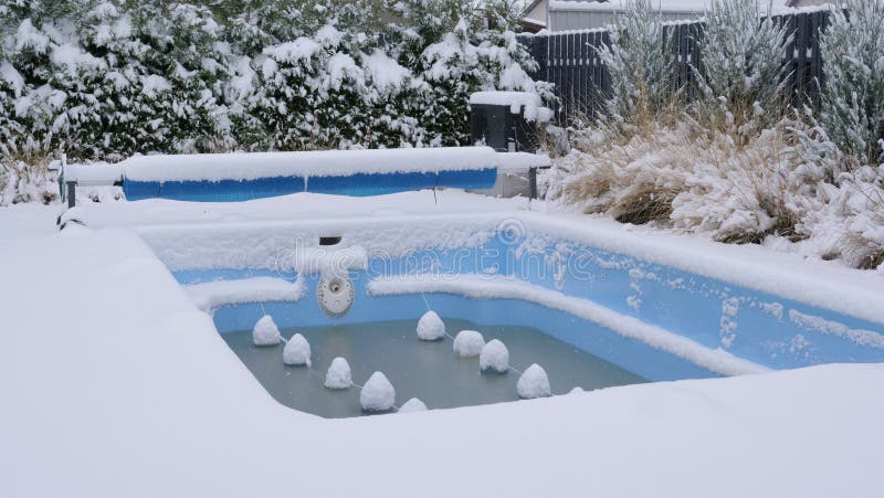 A Small Outdoor Pool Covered with Snow. Pool Under Conservation Stock ...
