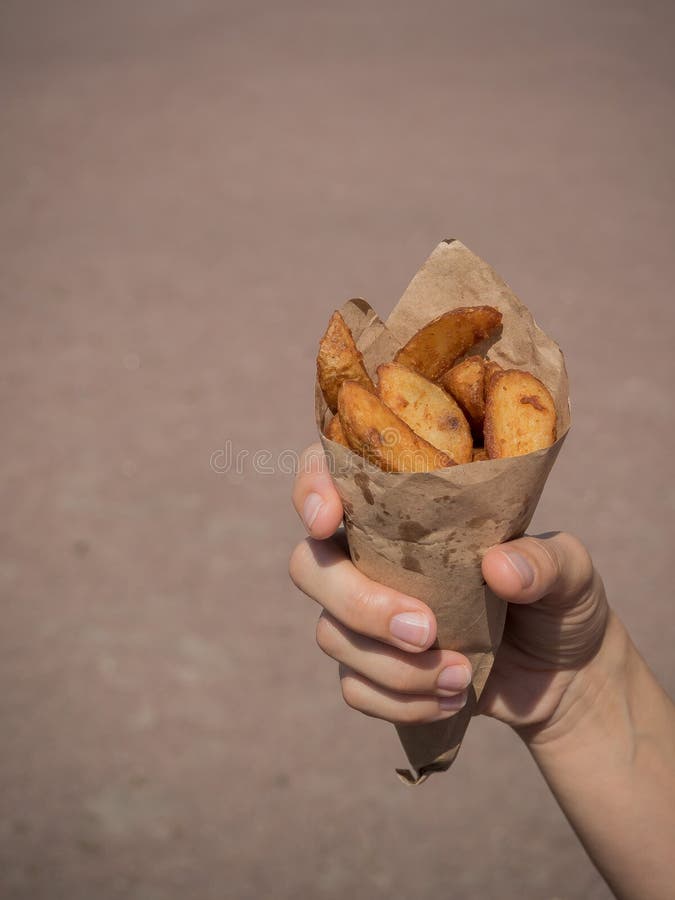 Small Pack of Potato Fries, Fast Snack in the Street. Stock Photo ...