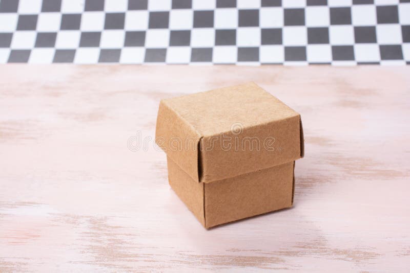 Small Paper Box on a Wooden Surface Stock Photo - Image of abstract ...