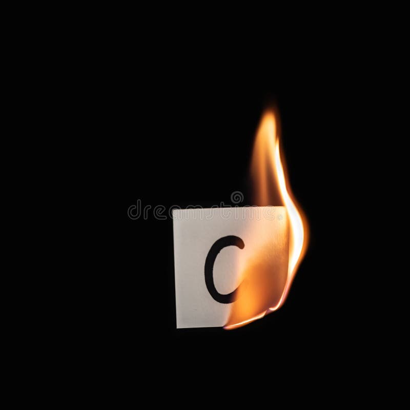 Small Paper with Letter C Burning on a Black Background Stock Image ...