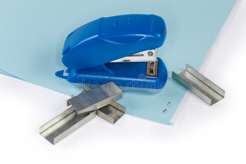 Small Paper Stapler and Spare Staples on Stapled Blue Sheets Stock ...