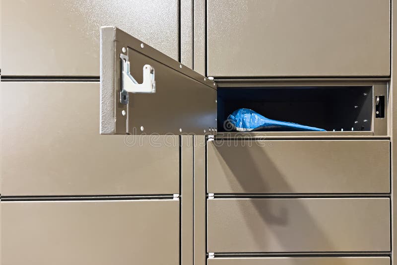 Small Parcel for Pick-up in the Opened Locker Stock Image - Image of ...