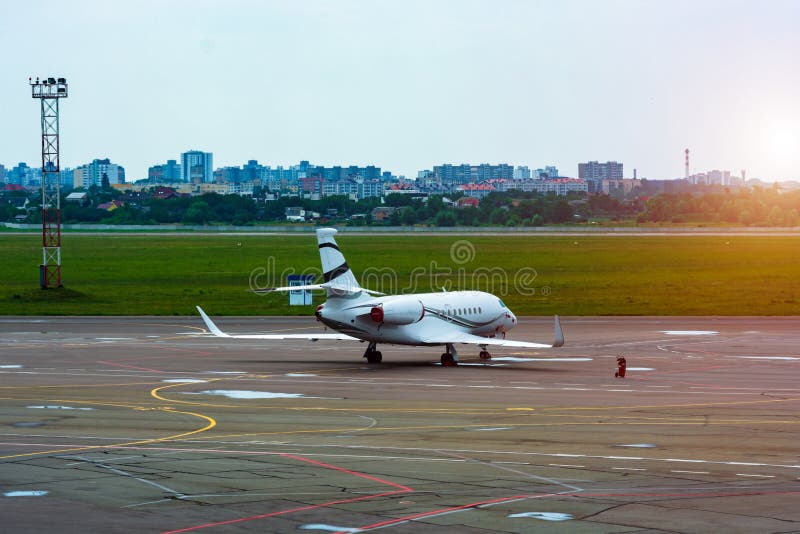 A Small Passenger Plane is on the Runway at the Airport Stock Image ...