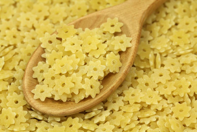 Small Pasta Shaped Stars in a Wooden Spoon Stock Image - Image of ...