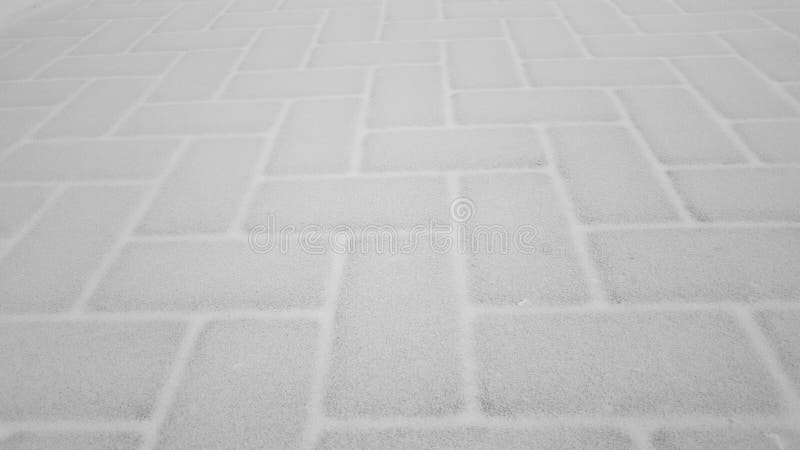 Small Paving Tiles of a Pavement Covered by Snow Stock Photo - Image of ...