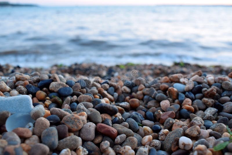 Small pebbles at the beach stock photo. Image of bank - 121964120