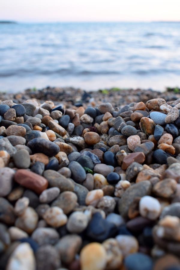 Small pebbles at the beach stock image. Image of stones - 121343277