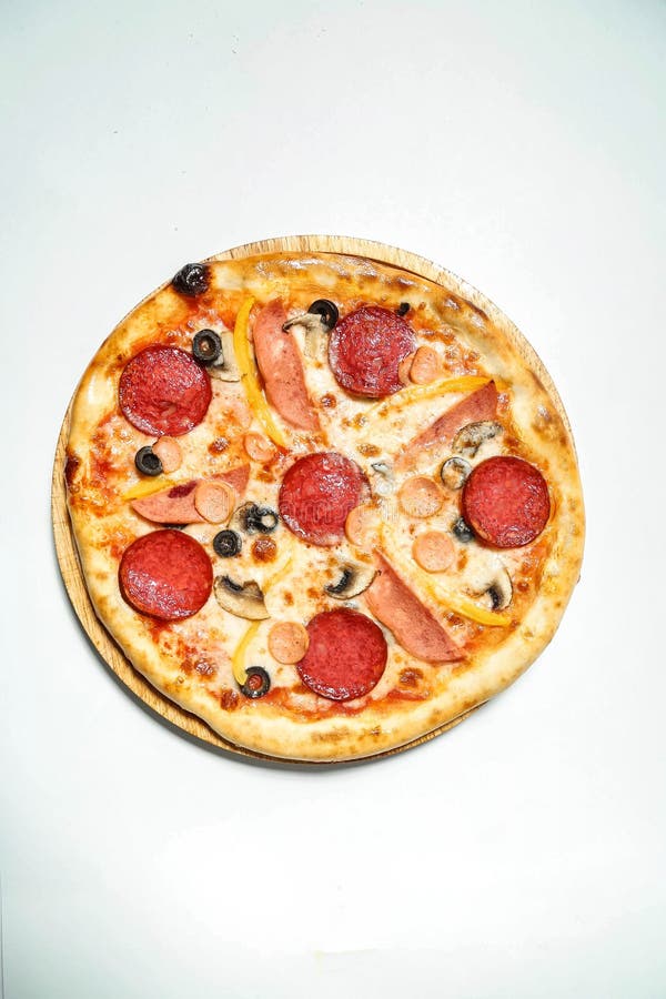 Small Pepperoni and Olive Pizza on White Surface Stock Photo - Image of ...