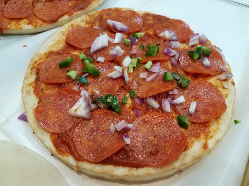 Small Pepperoni Pizza with Slices of Salami Meat and Vegetables Stock ...
