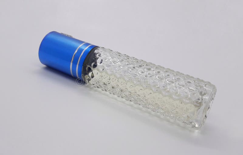 Small Perfume Bottle with Blue Cap Stock Image - Image of skin, white ...
