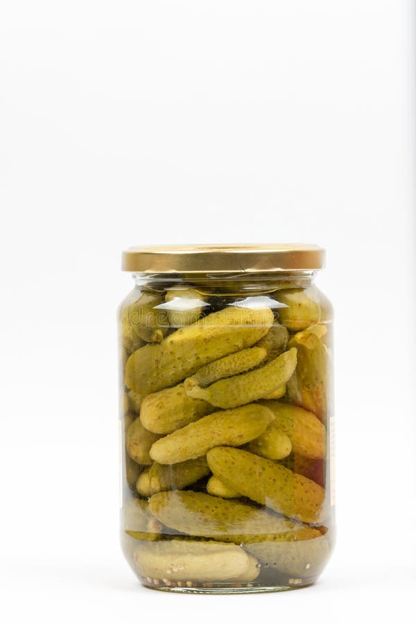 Small Pickles in the White Bowl and Pickle on the Fork Stock Photo ...