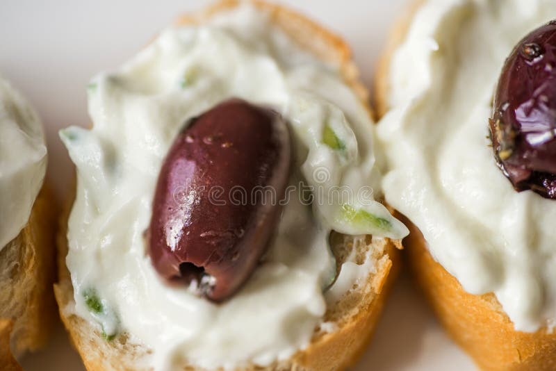 Small Piece of Bread with Tzatziki Spread and Olive Fruit Stock Image ...