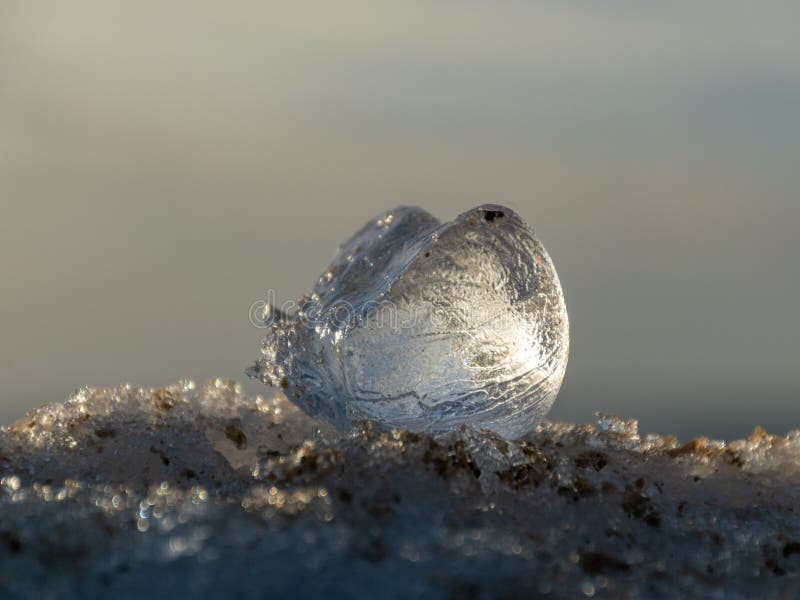 A small piece of ice glows stock image. Image of white - 154858445