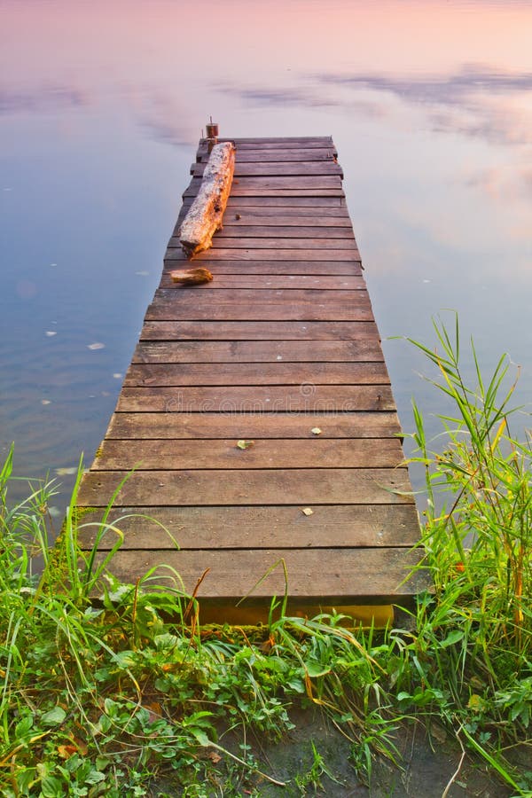 Small Pier Bridge Against the Background of a Dawn Orange Blue Stock ...