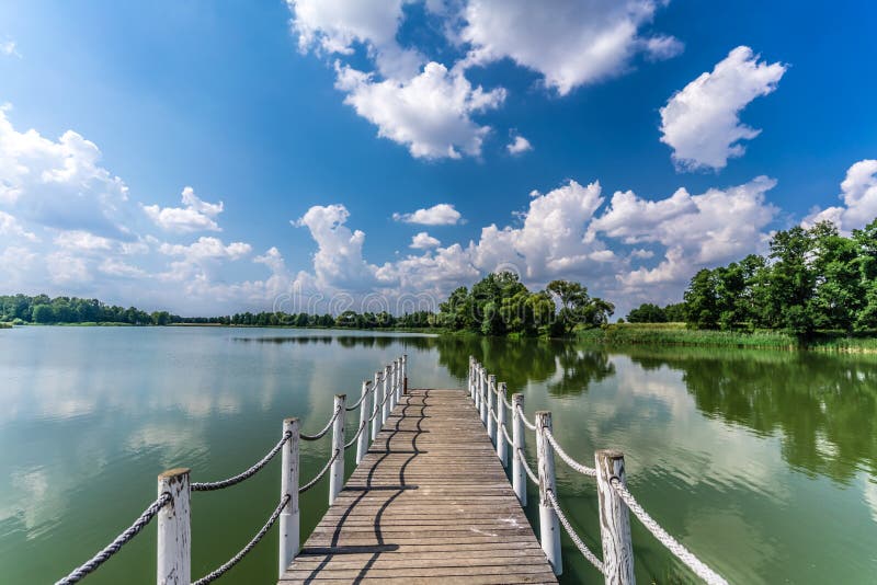 Small Pier in a Lake Captured on a Beautiful Sunny Day Stock Image ...