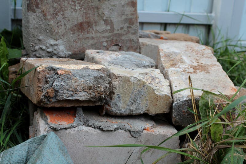 A Small Pile of Bricks in Dried Cement Stock Photo - Image of ...