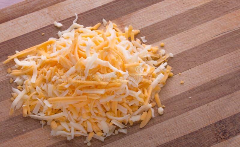 Small Pile of Greated Cheese of Different Types Stock Photo - Image of ...