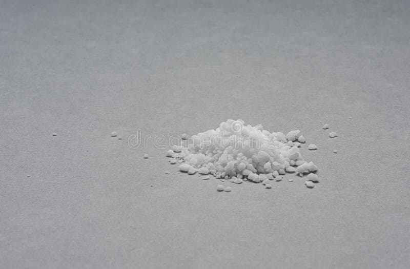 Small Pile of Salt Crystals on Grey Background Stock Image - Image of ...