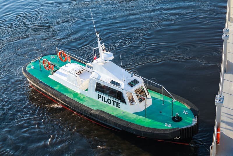 Small Pilot Boat with Green Deck and Black Hull Stock Image - Image of ...