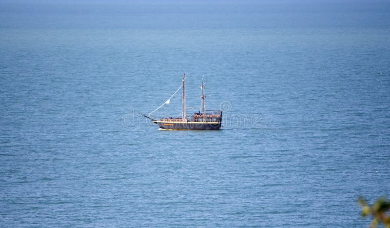 A Small Pirate Tourist Ship in the Blue Waters of the Sea Stock Photo ...