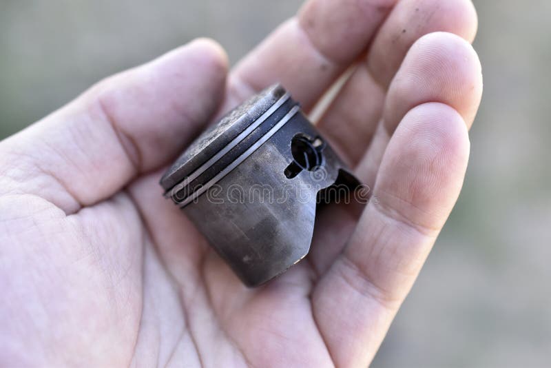 A Small Piston in the Hand from an Internal Combustion Engine Stock ...