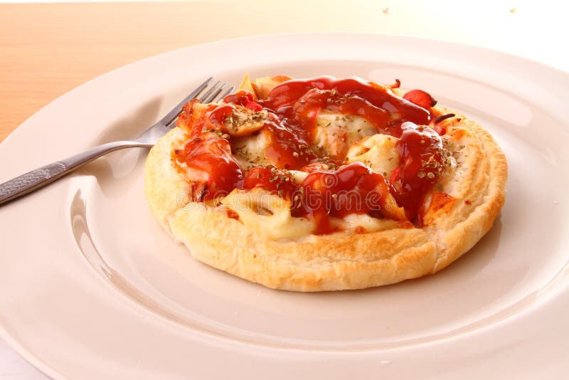 Small pizza on dish stock image. Image of tomato, spicy - 45693179
