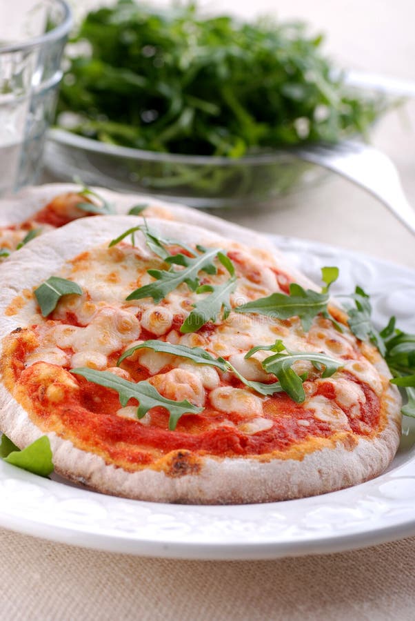 Small pizza on the plate stock photo. Image of tomato - 29604634