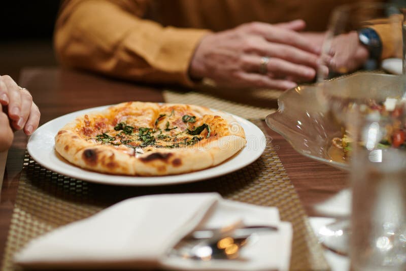 Small Pizza on Plate stock photo. Image of guest, lifestyles - 260934174