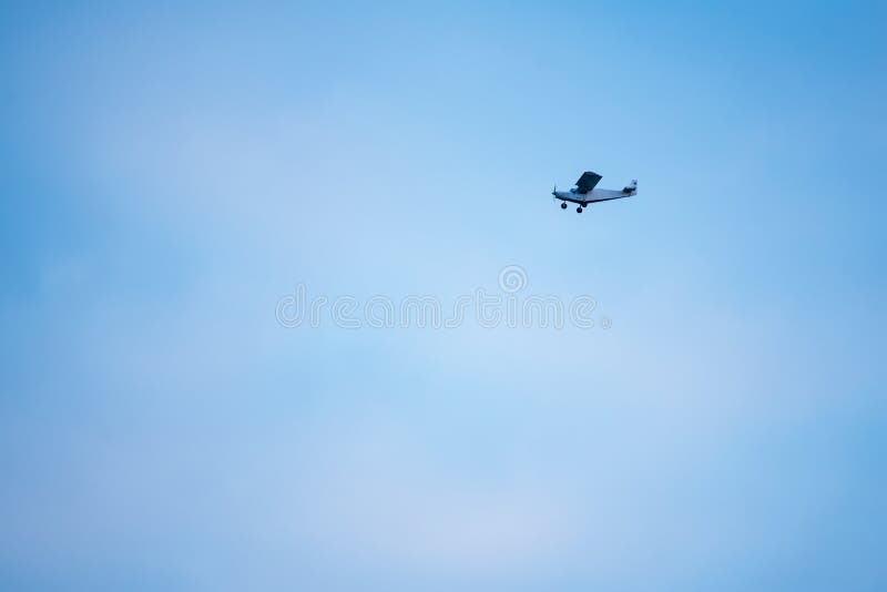Small Plane in the Air. Blue Sky with White Clouds. Stock Photo - Image ...