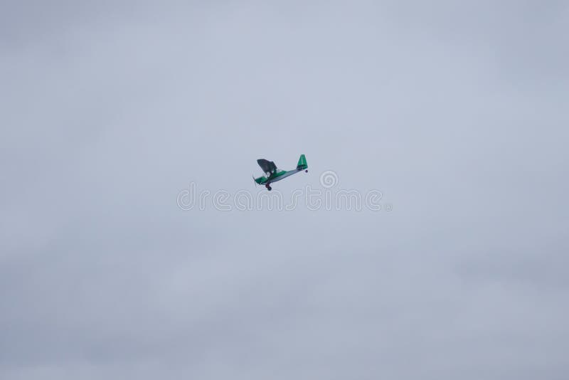 Small Plane Flies Against Background of the Cloudy Sky, Private ...