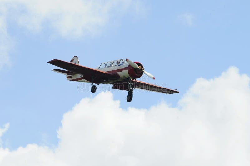 The Small Plane Flies Against Clouds. Editorial Photo - Image of plane ...