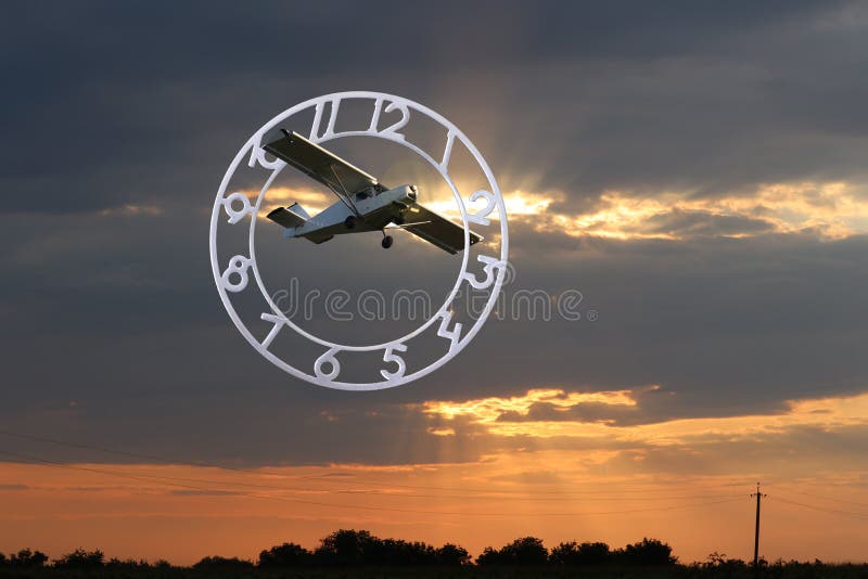 Small Plane Flies through the Clock Face on the Background of Dramatic ...