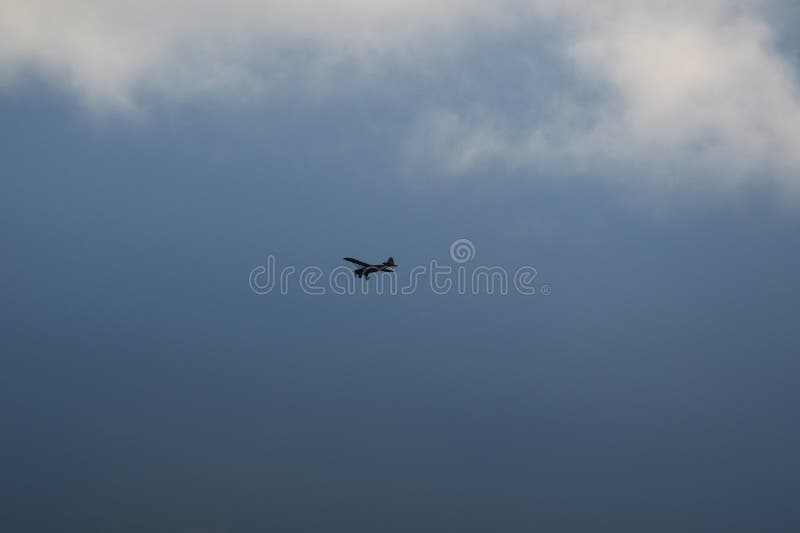 Small Plane Flying on a Blue Sky Stock Image - Image of silhouette ...