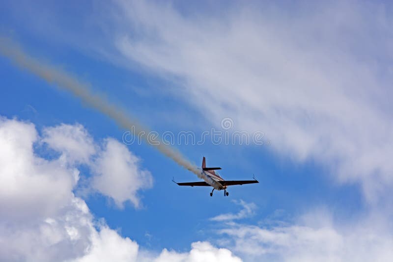 Small Plane Flying with Smoke Stock Photo - Image of transportation ...