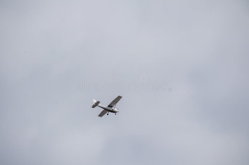 .small Plane in the Sky on a Blue Background Stock Photo - Image of ...