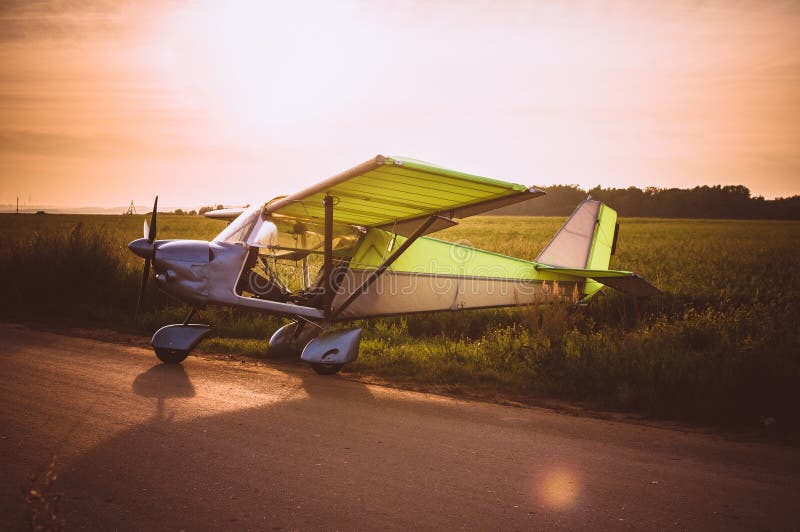 Small Plane in the Sky and on the Field Stock Image - Image of flying ...