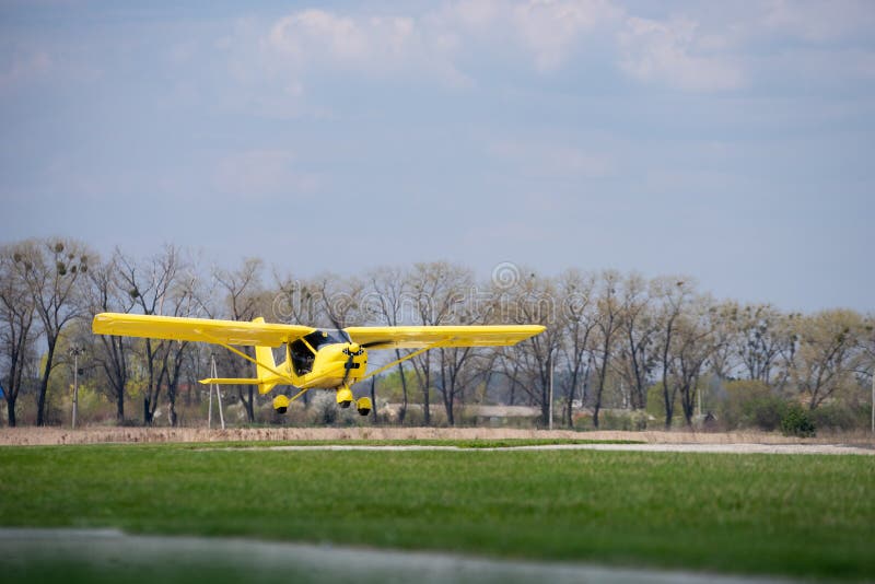 Small Plane Taking Off from Green Field. Concept of Increase and ...