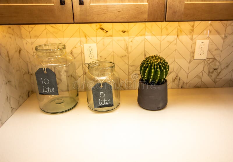 Plant and 2 Glass Containers on Kitchen Counter Top Stock Photo - Image ...