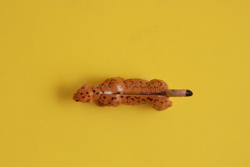 Small Plastic Leopard Toy Isolated on a Yellow Background Stock Image ...