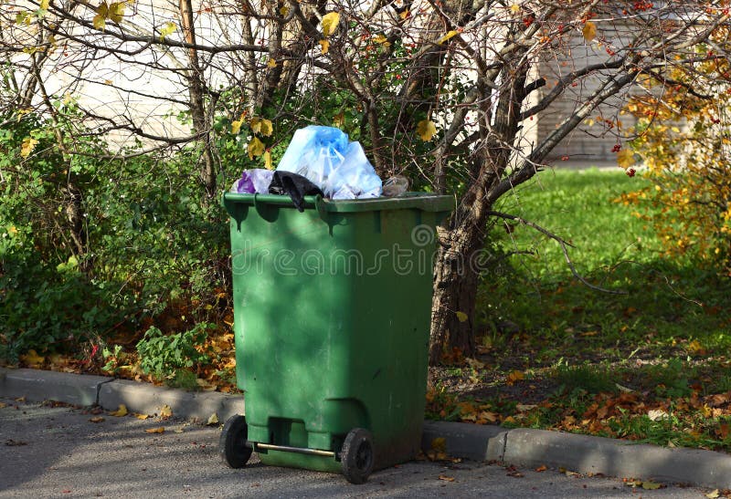 Small Plastic Mobile Garbage Container Filled with Garbage Stock Photo ...