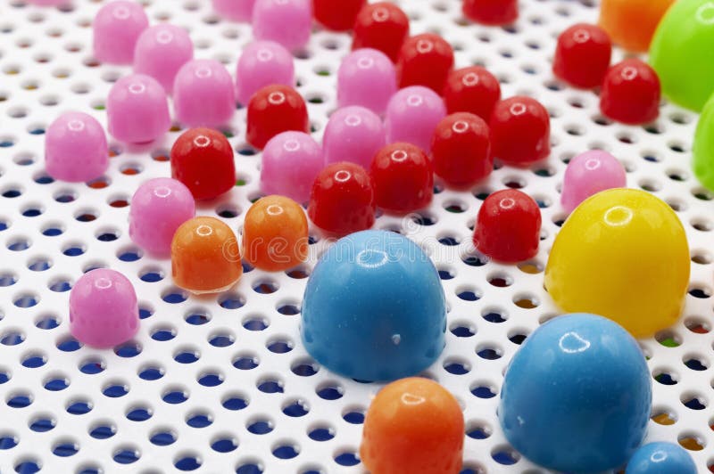 Small Plastic Plugs in Different Colors on a White Hole Pattern Stock ...
