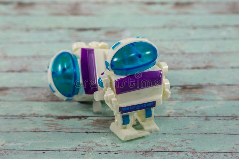 Small Plastic Robot Toys On White Wooden Table Stock Photo - Image of ...