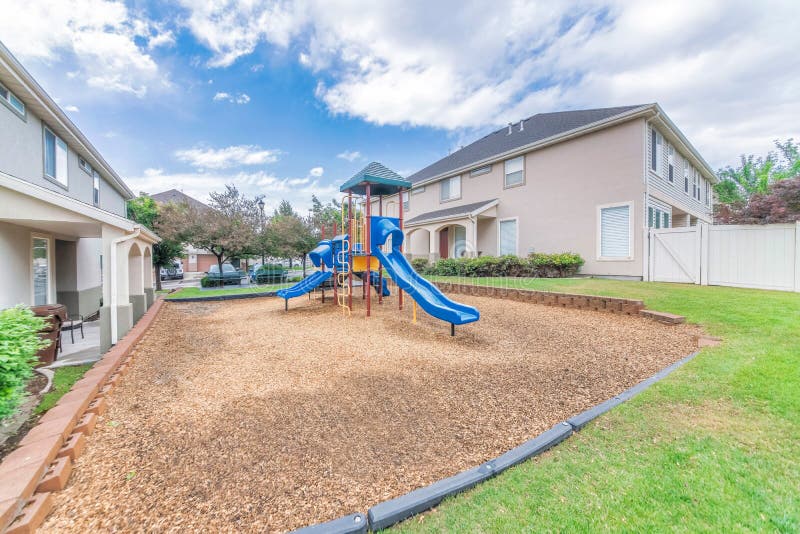 Small Playground with a Slide in a Homeyard Stock Photo - Image of ...