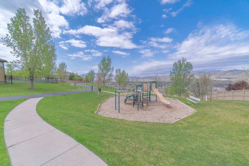 Small Playground with a Slide in a Park Stock Photo - Image of park ...